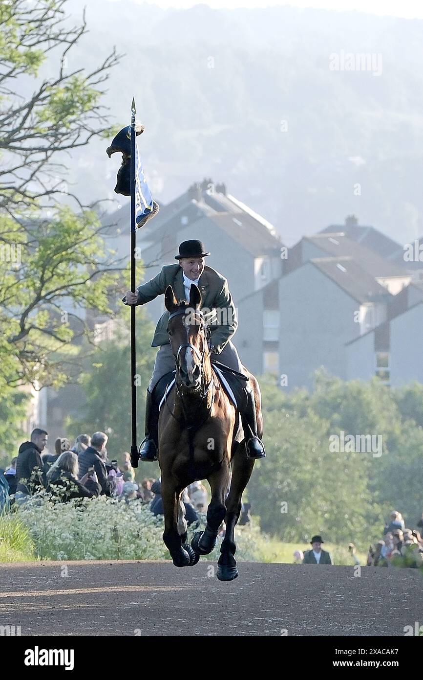 Ryan Nichol carries the unbussed 'Banner Blue' flag. Leads the ...