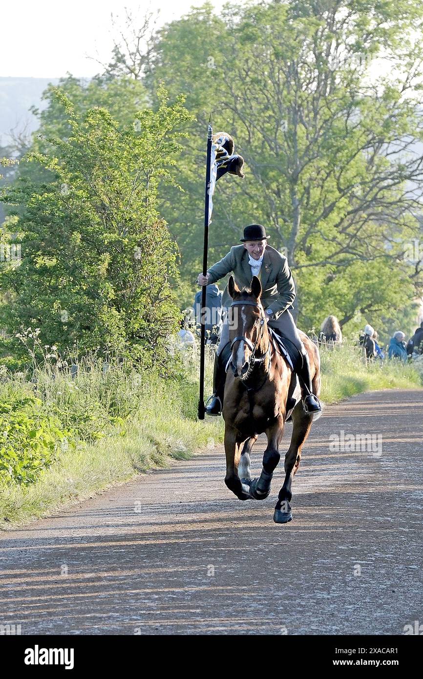 Ryan Nichol carries the unbussed 'Banner Blue' flag. Leads the ...