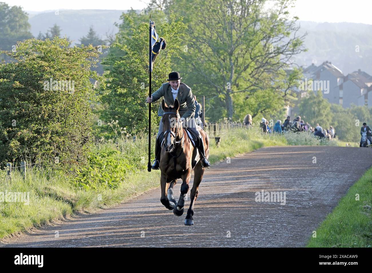 Ryan Nichol carries the unbussed 'Banner Blue' flag. Leads the ...