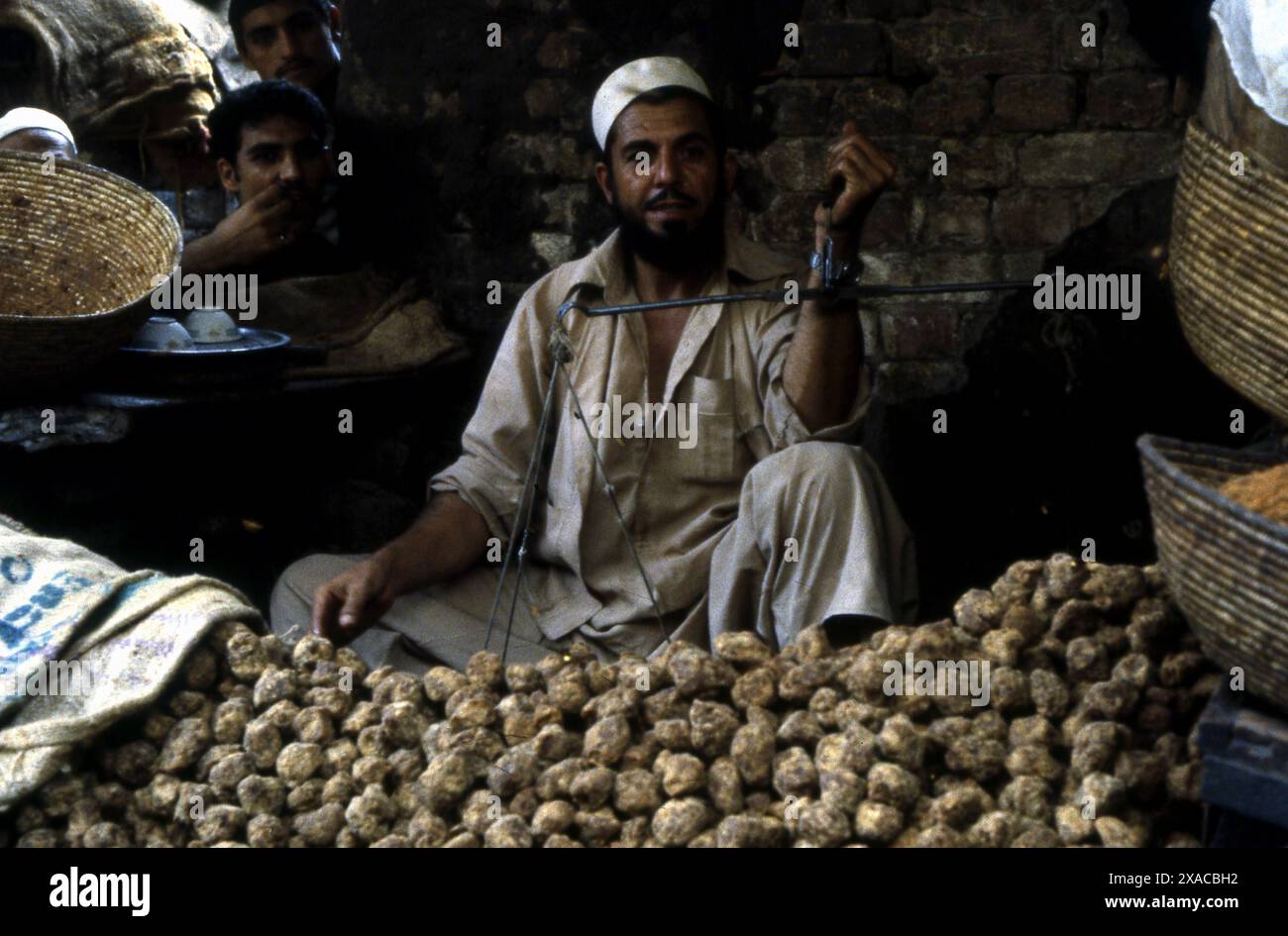 Shop and shopkeeper Peshawar 1984 Stock Photo - Alamy