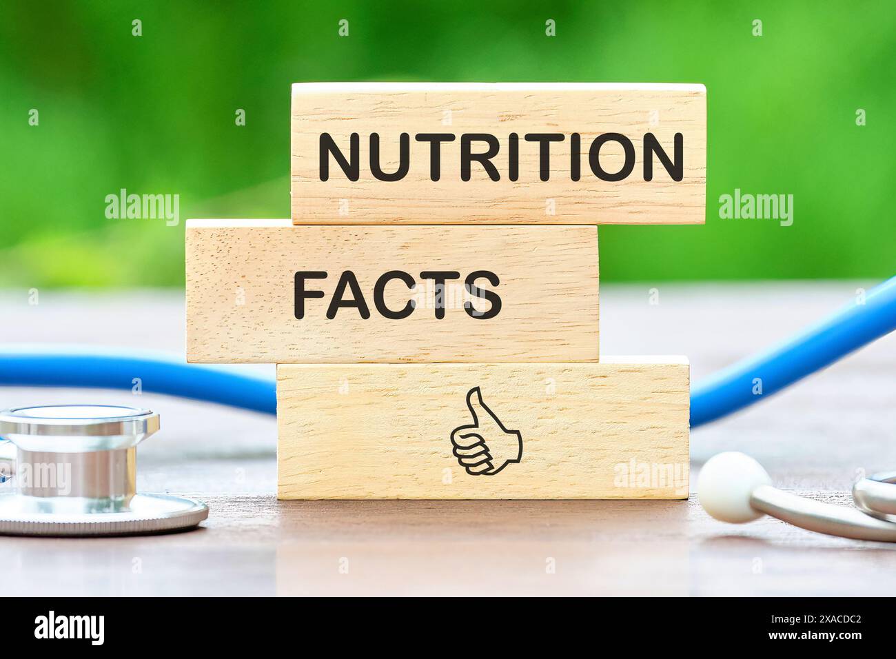 Nutrition facts text written on wooden bars next to the stethoscope ...