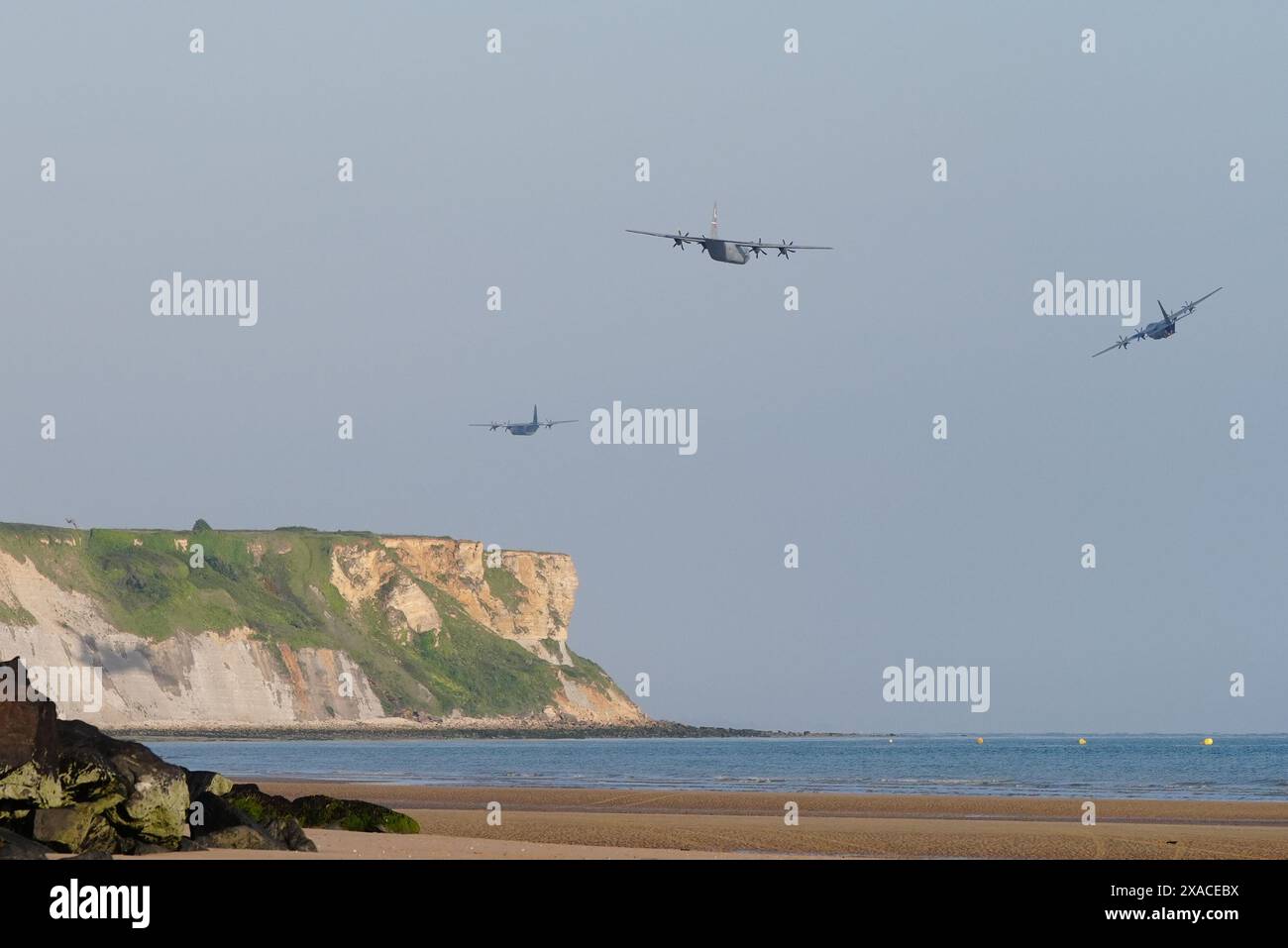 Planes fly over the beaches at Arromanches in Normandy, France, to ...