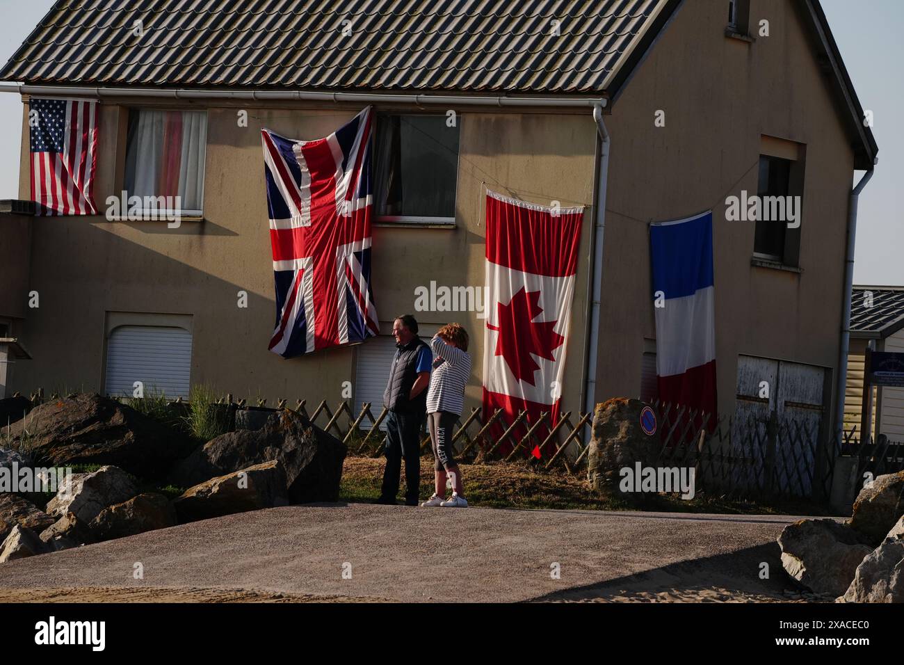 A house decked with national flags from USA, UK, Canada and France, near Gold Beach in ...