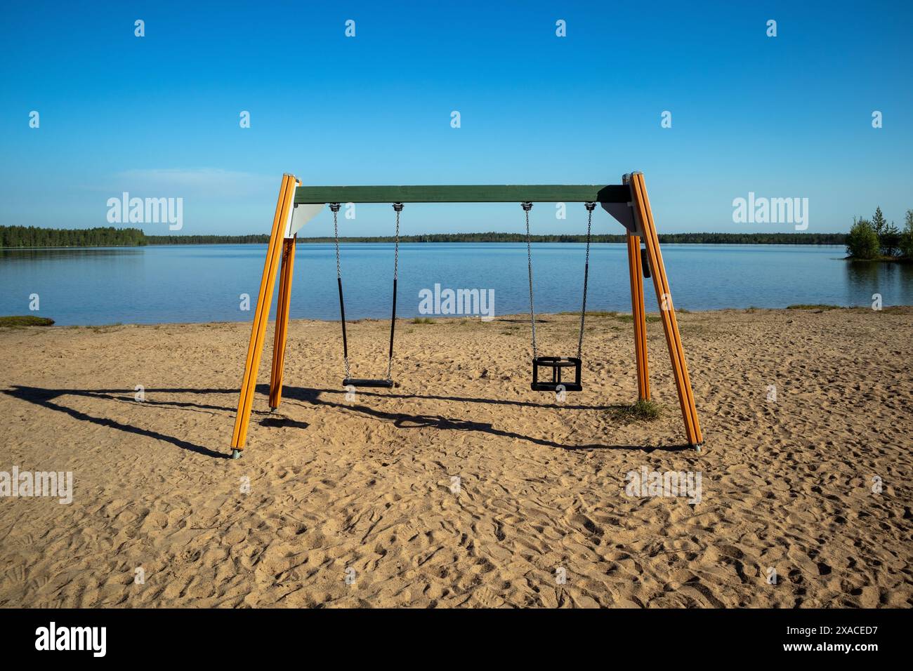 Blue swings on empty playground hi-res stock photography and images - Alamy