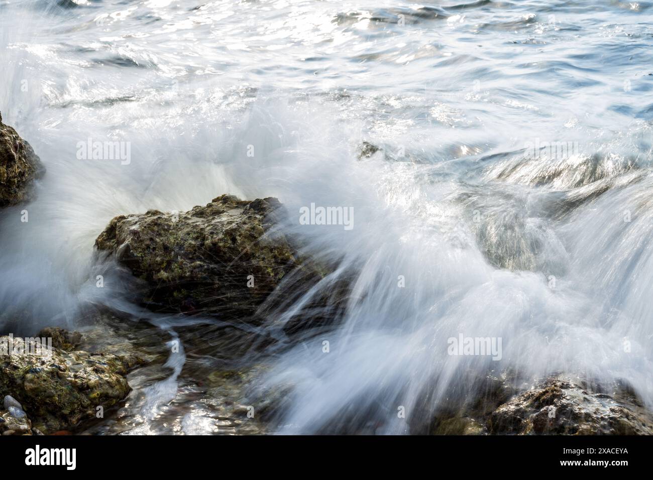 Waves hitting cliff on beach hi-res stock photography and images - Alamy