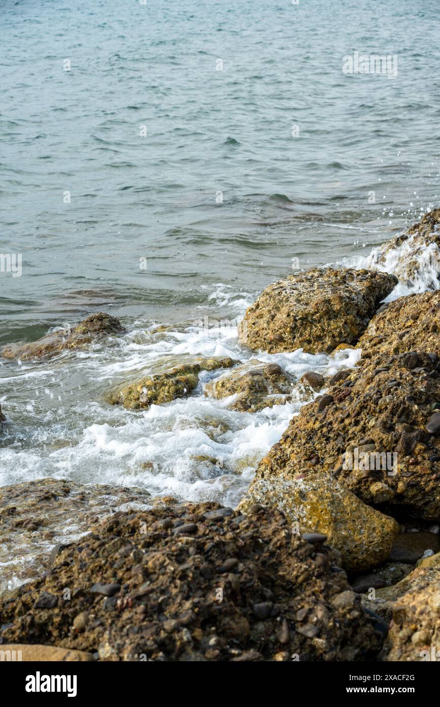 Beach waves hitting shoreline rock hi-res stock photography and images ...