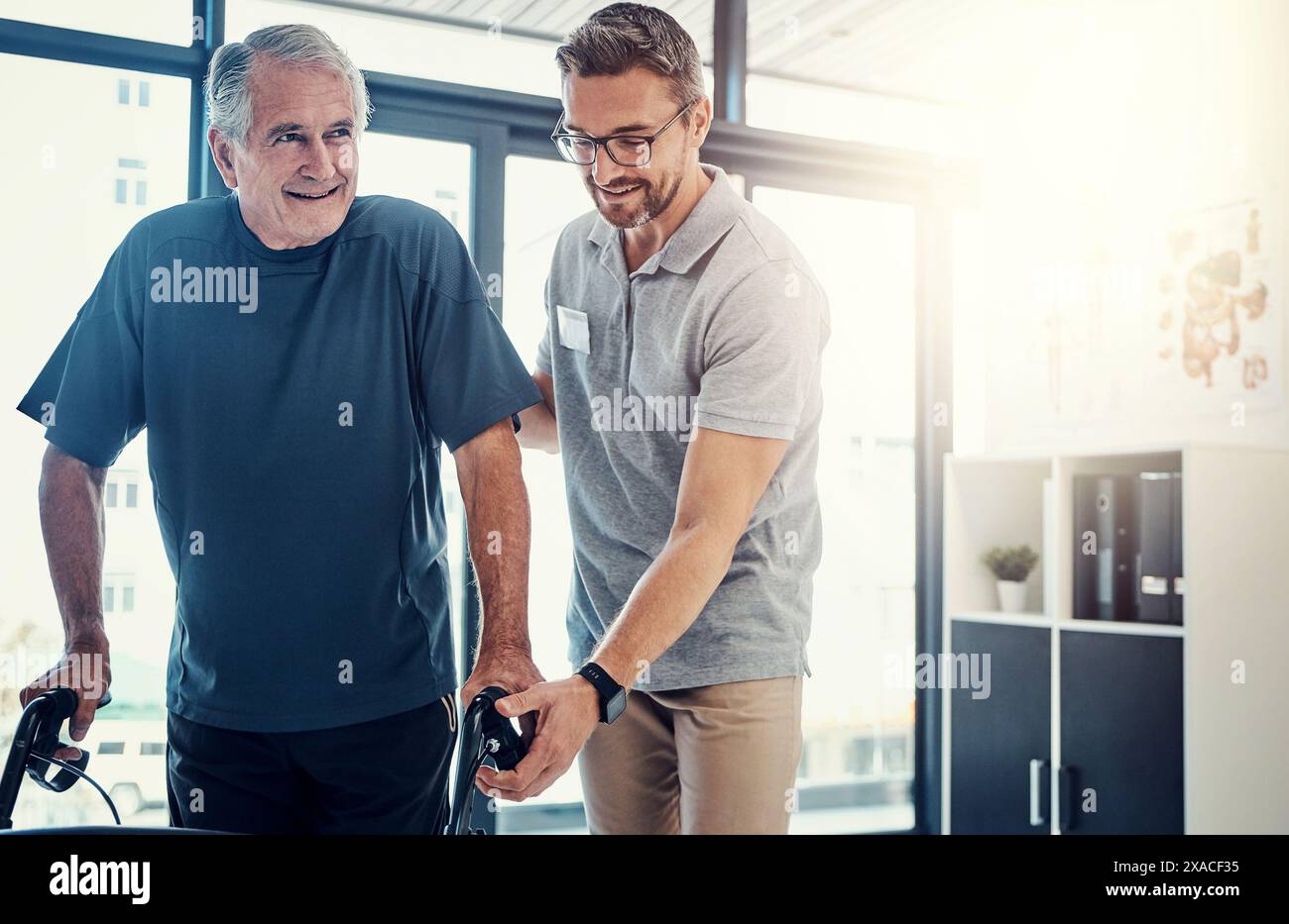 Hospital, senior man and nurse with help, rehabilitation and ...