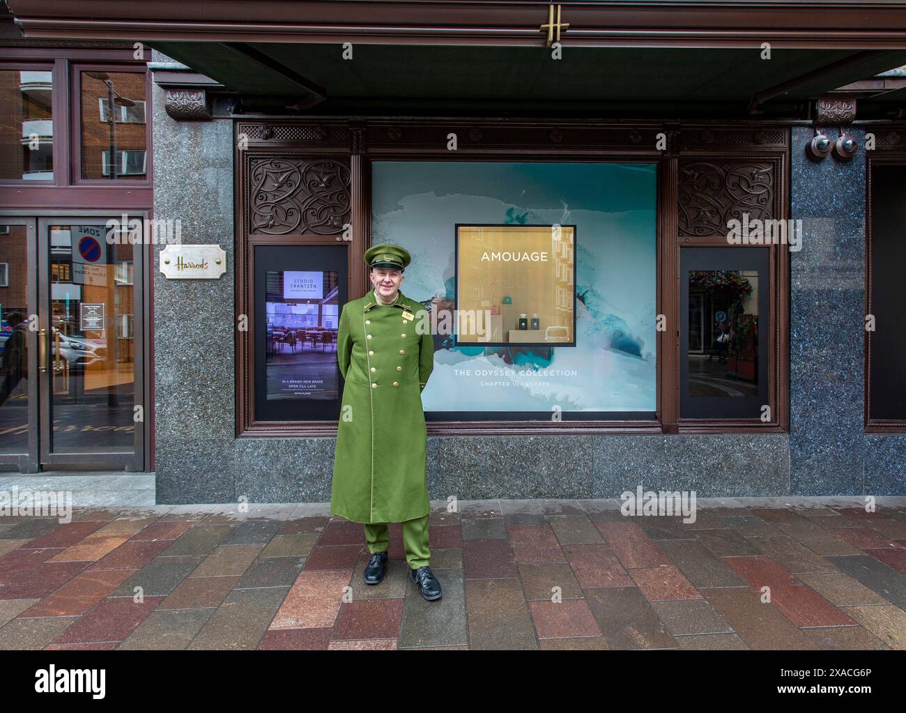 Famous Harrod's Doorman with distinctive bright green, gold buttoned ...