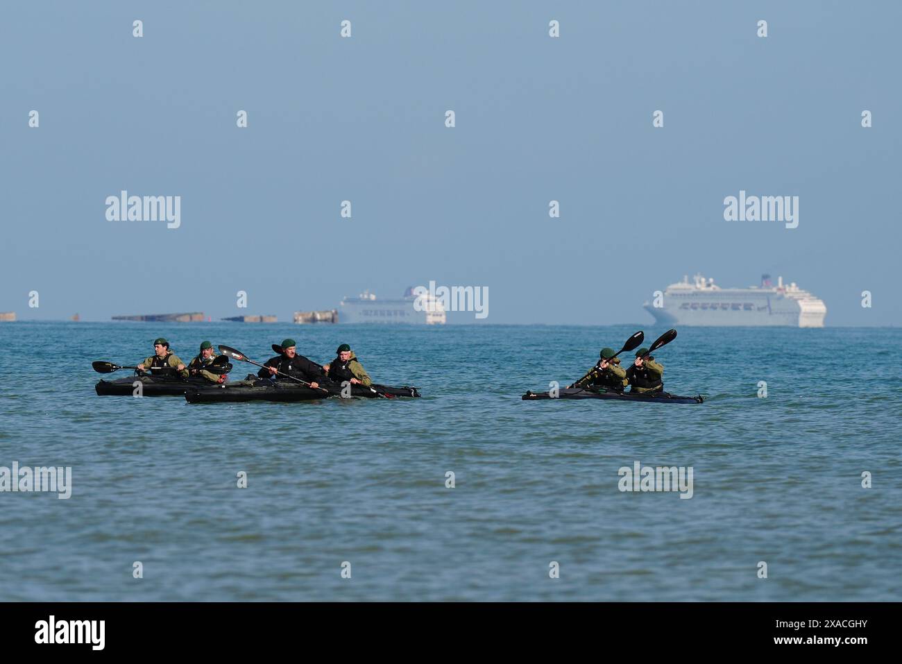 A beach landing by the Royal Marines of 47 Commando and civilians at ...