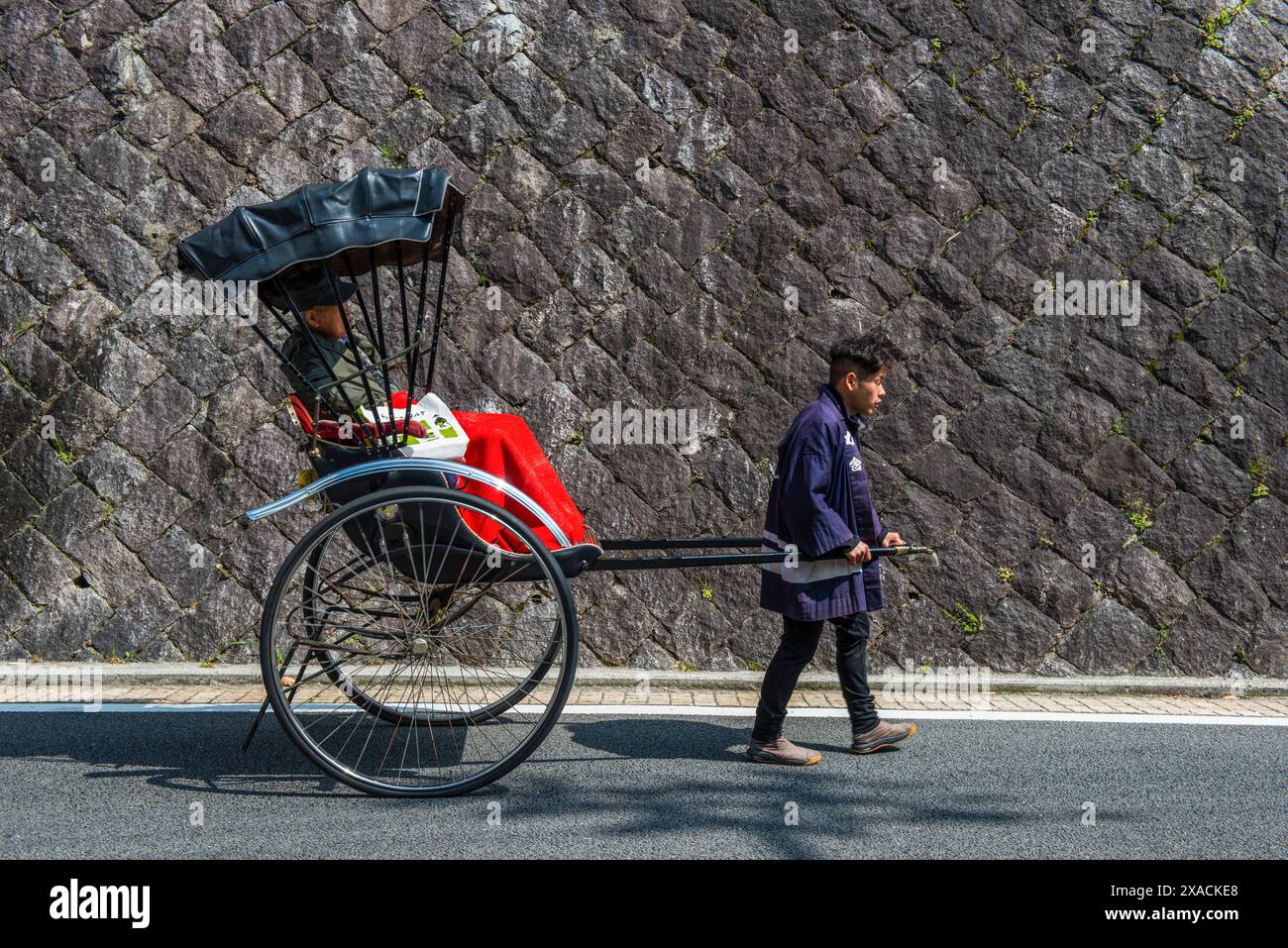 Japanese rickshaw in front of the Dogo Onsen old spa, Matsuyama ...