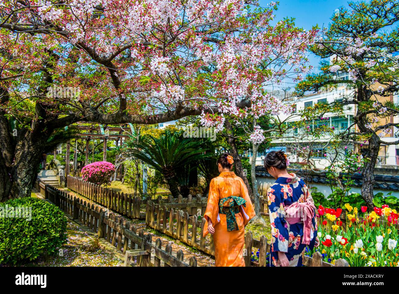 Traditionally dressed women in Dejima, a man made island in the port of ...