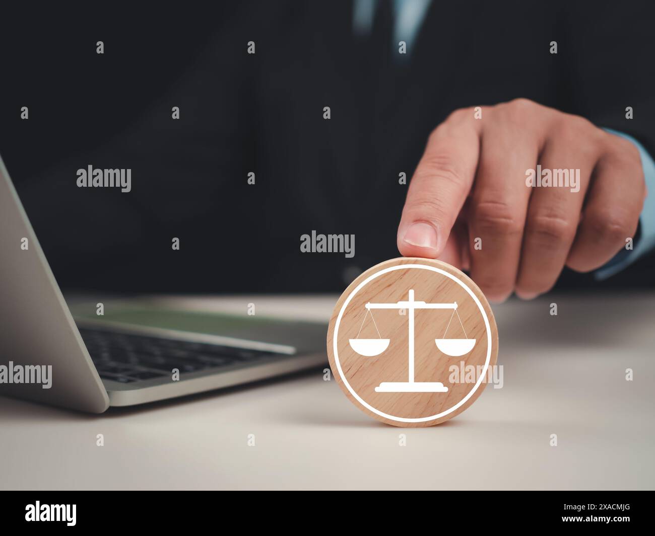 Businessman pointing at circular piece of wood with a scale mark for ...