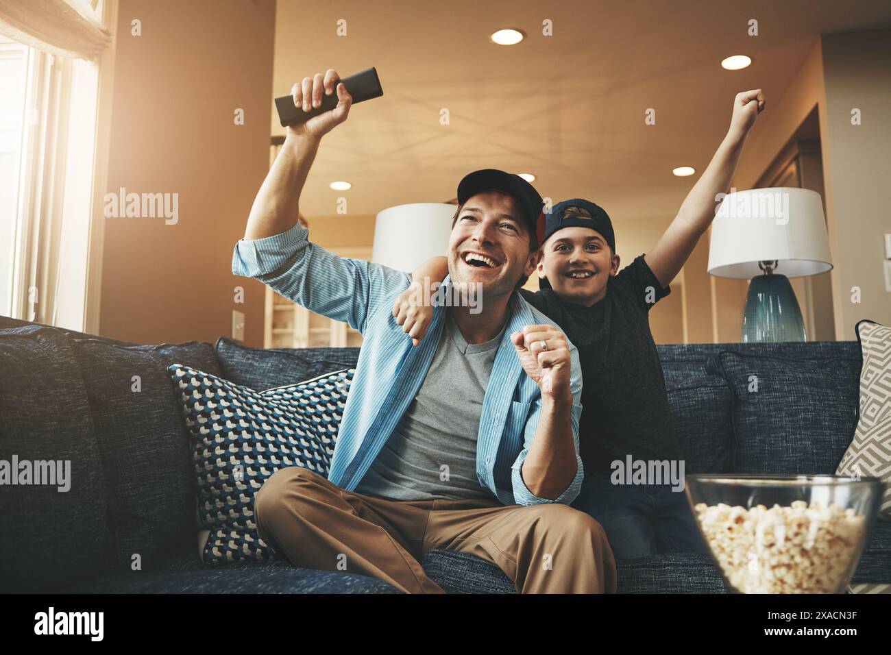 Popcorn relax dad watching hi-res stock photography and images - Alamy
