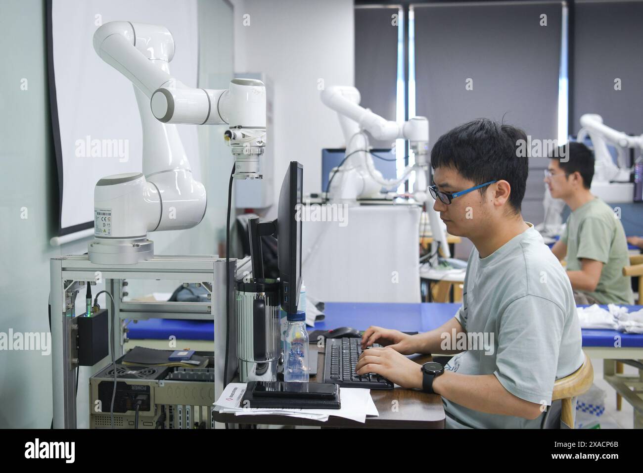 Wuhan, China's Hubei Province. 3rd June, 2024. Algorithm engineer Guo Shengwei upgrades the ...