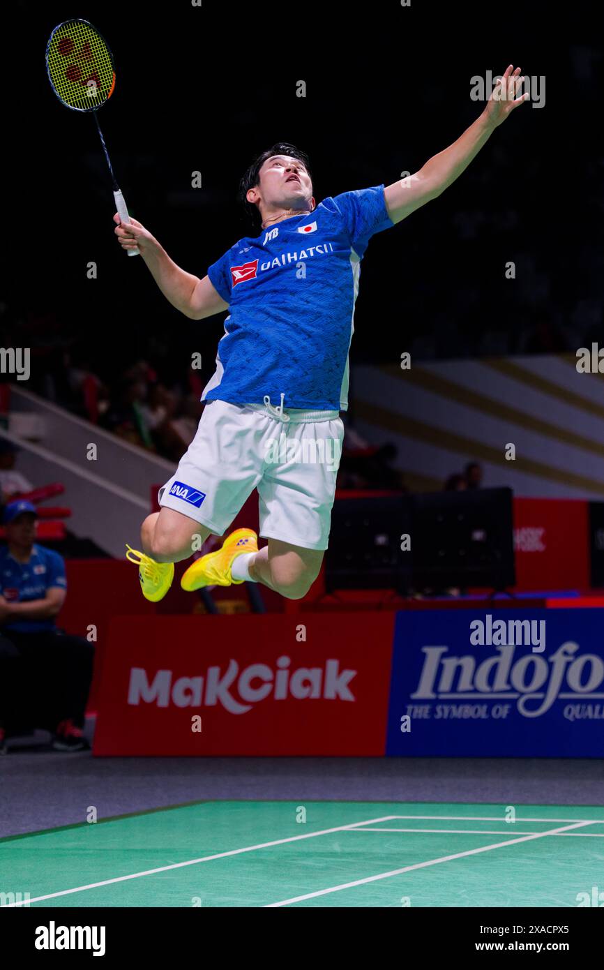 Takuro Hoki of Japan in action during the mens doubles match on day two ...