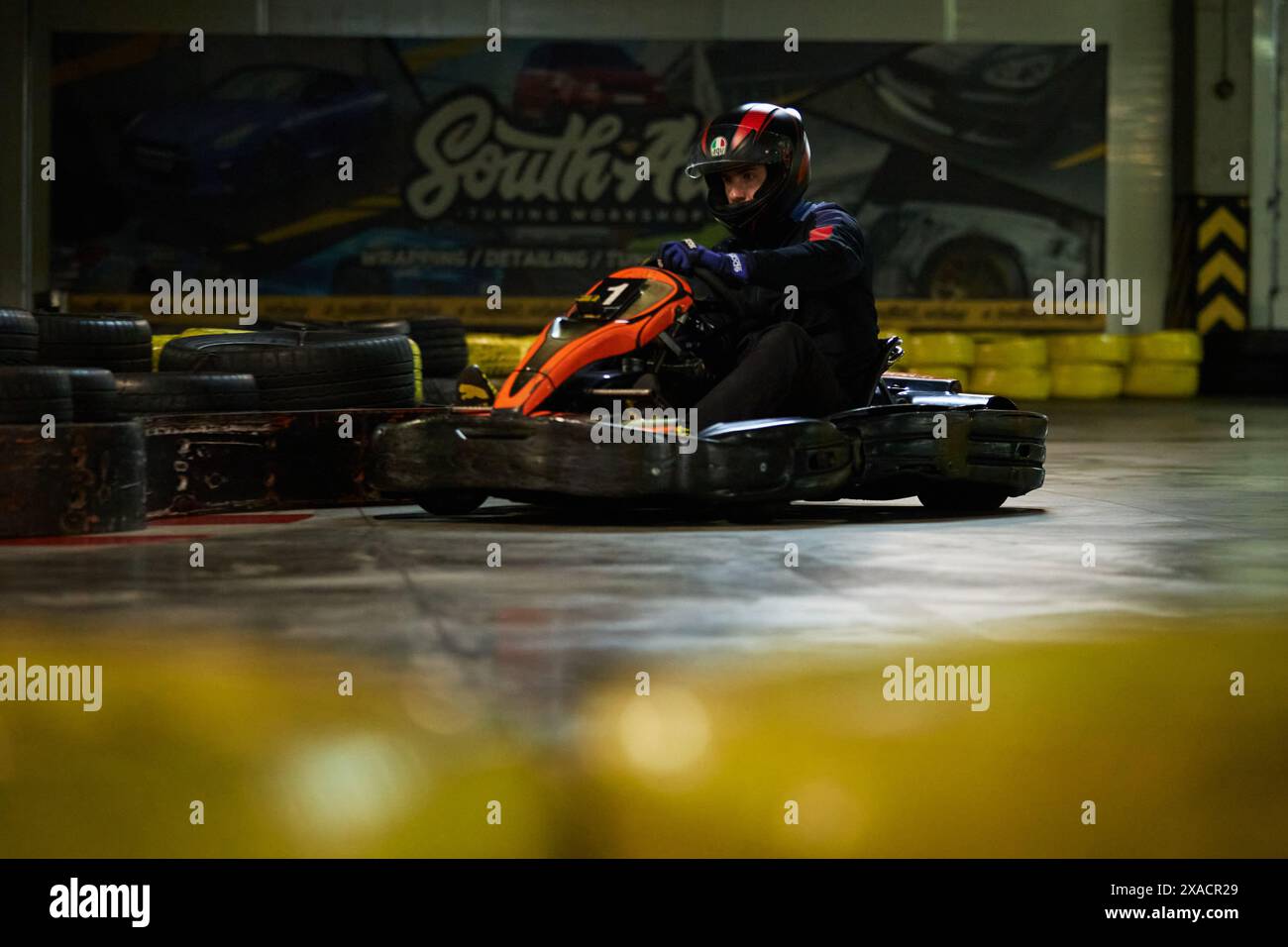Professional kart racer rides on a go kart car on a track. Kyiv - 26 ...