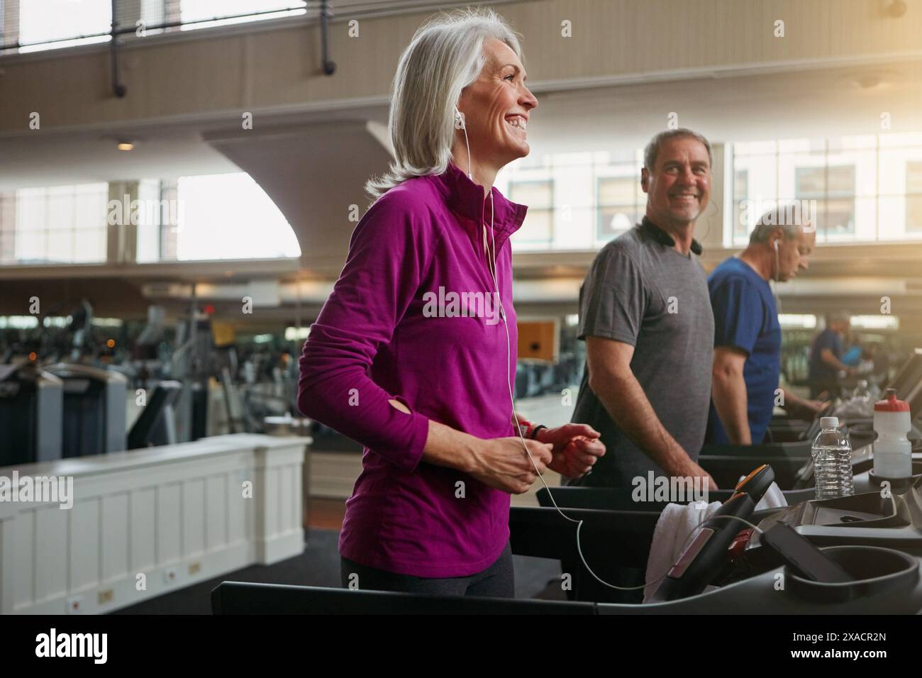 Exercise, treadmill and senior people running in gym for workout ...