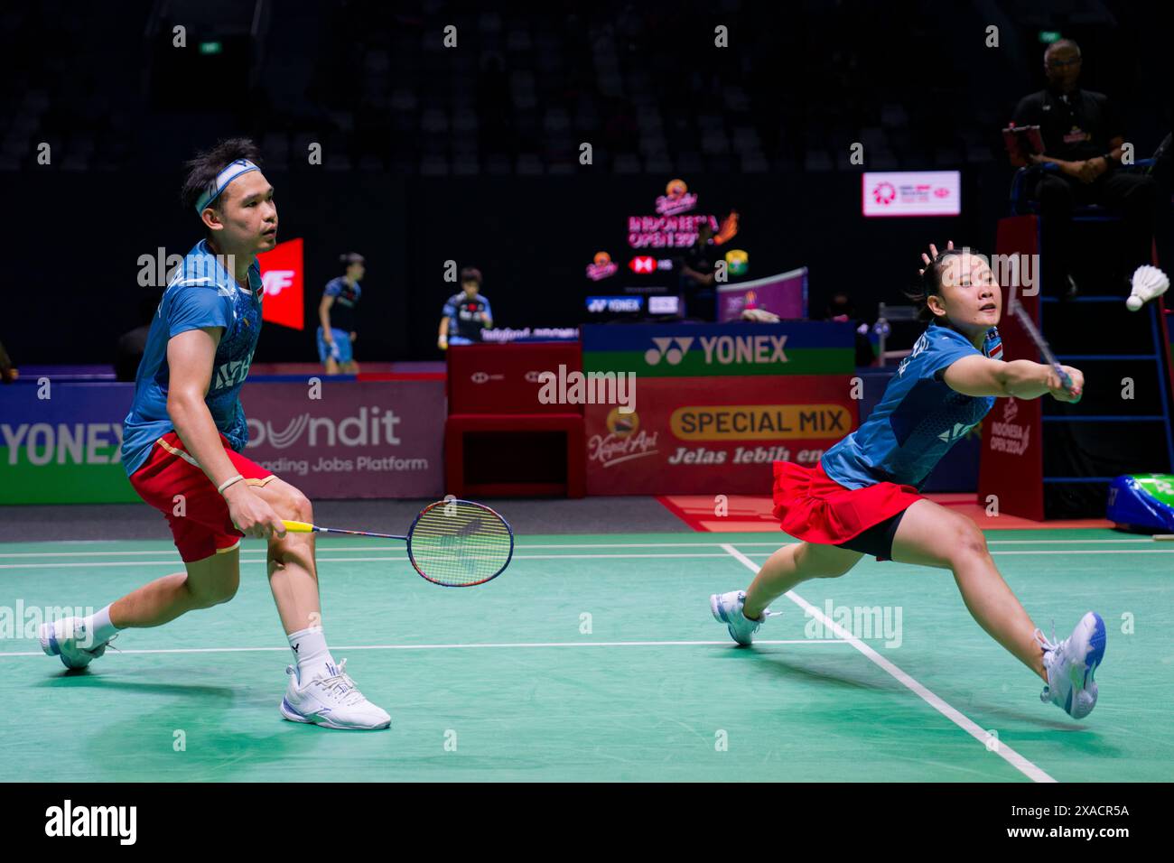 Rinov Rivaldy and Pitha Haningtyas Mentari of Indonesia in action during the mixed doubles match ...