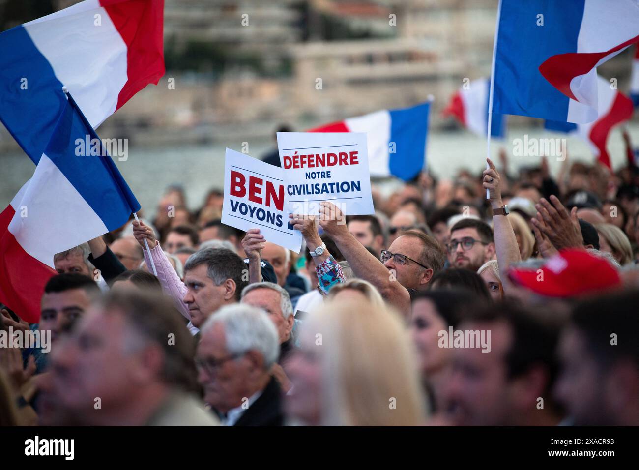 Signs held up by supporters during the Reconquete! party's final ...