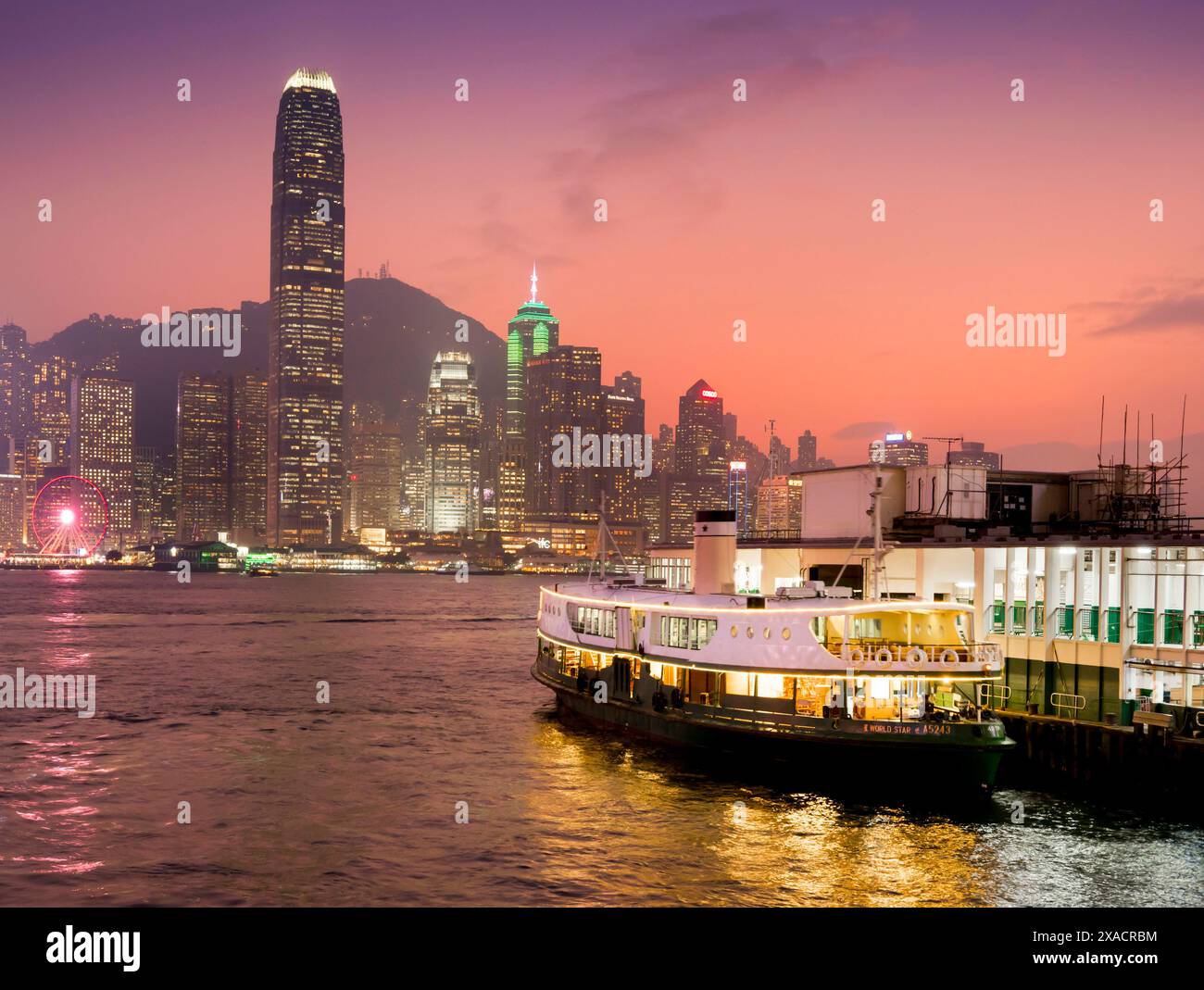 Hong Kong Island waterfront with Star Ferry in the evening, Hong Kong ...