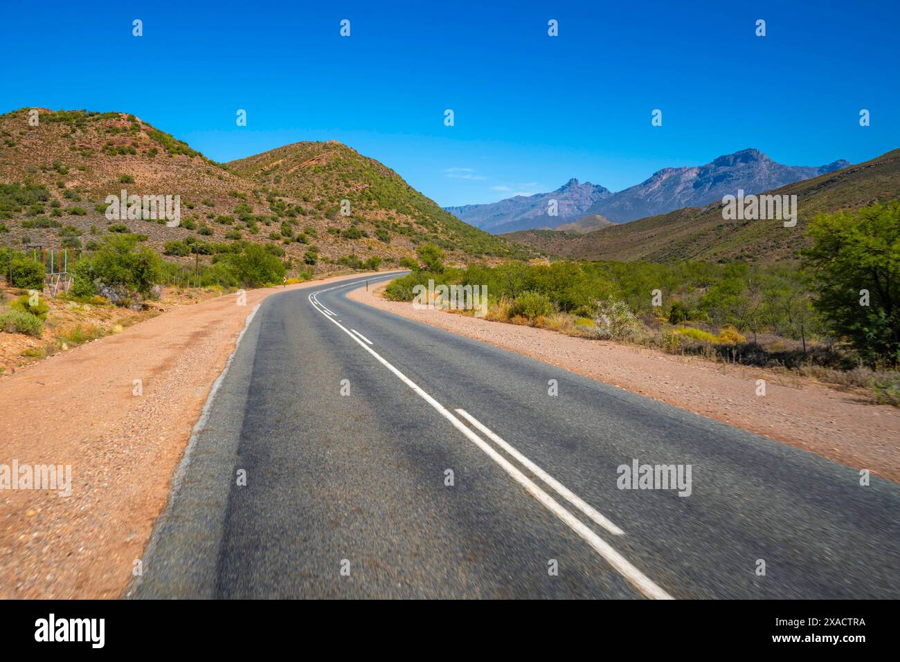View of road R62 and green mountainous landscape between Zoar and ...