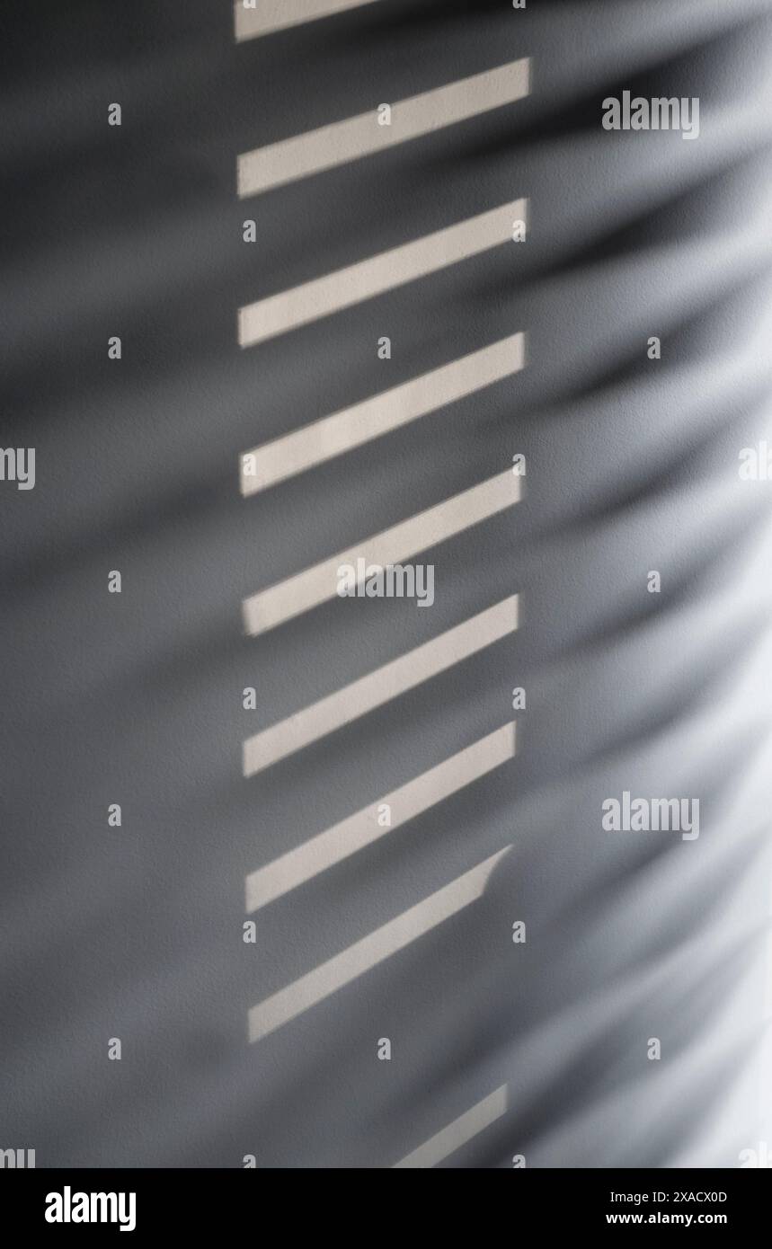 sunlight on grey wall through window blinds Stock Photo - Alamy