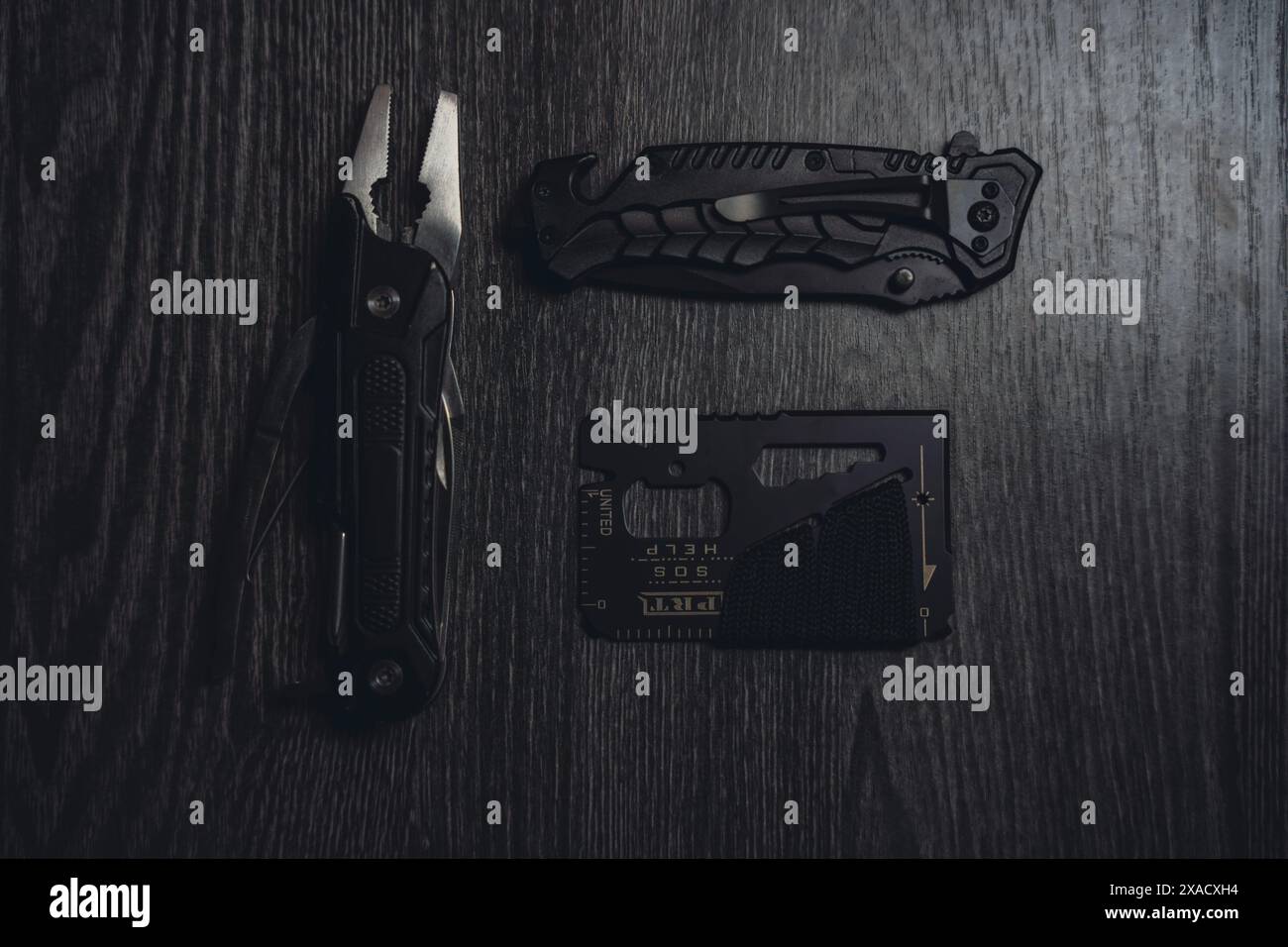 Wild Survival Kit. Items on a wooden table. Gloomy photo. High quality ...