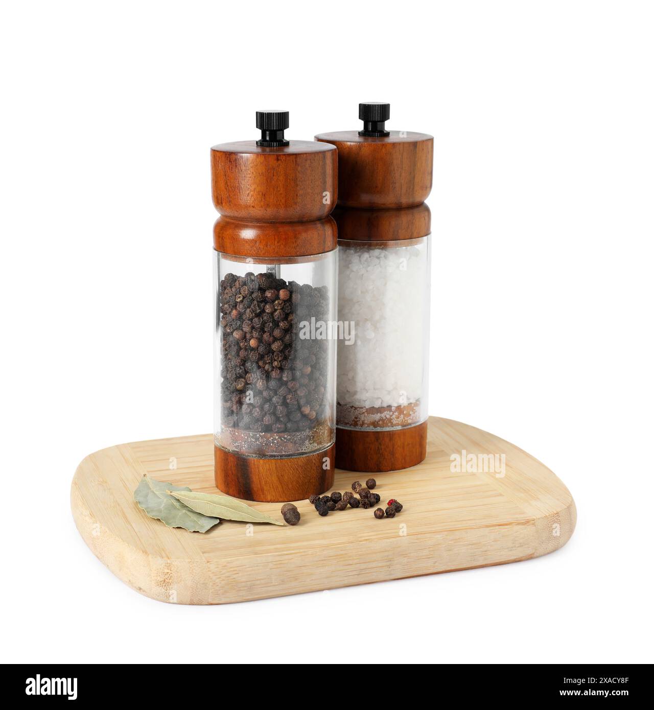 Salt and pepper shakers with bay leaves isolated on white Stock Photo ...