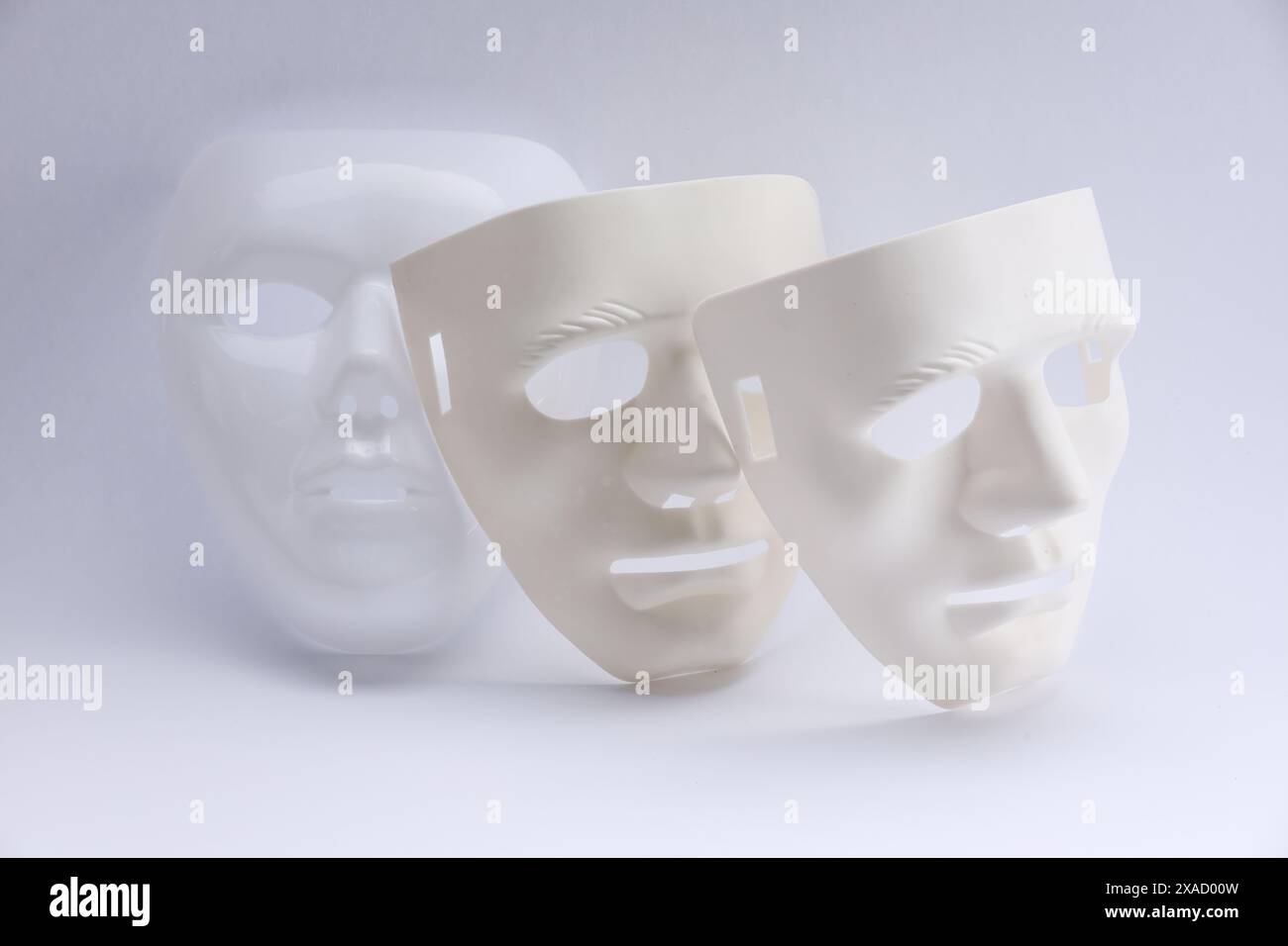 Plastic face masks on white background. Theatrical performance Stock ...