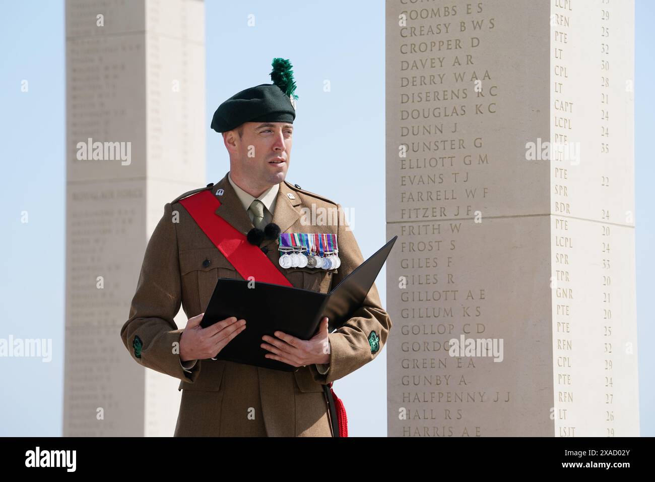 Warrant Officer 2 Chris Milliken, British Army, reads the words of ...