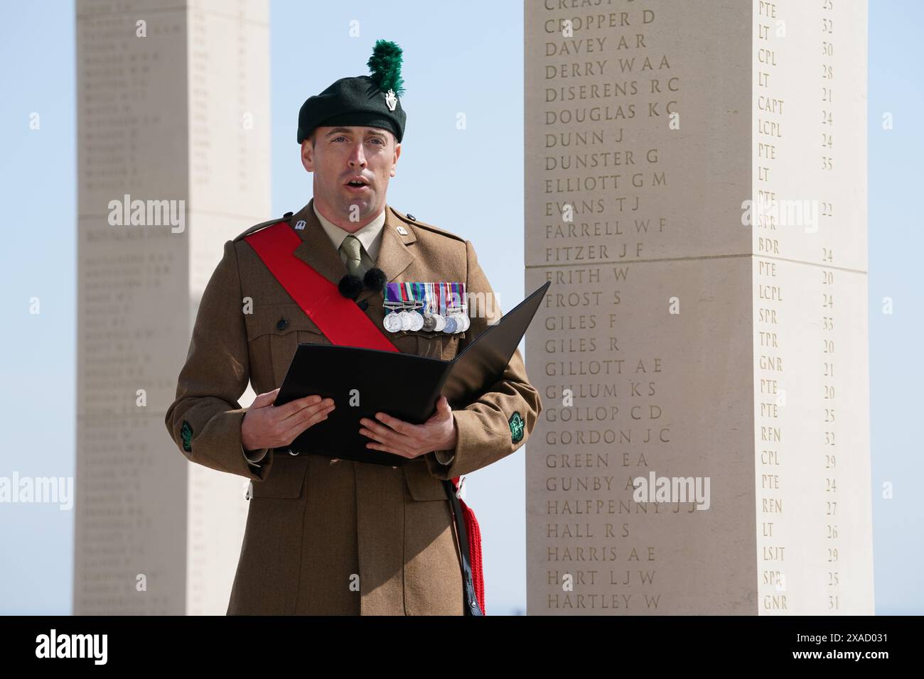 Warrant Officer 2 Chris Milliken, British Army, reads the words of ...