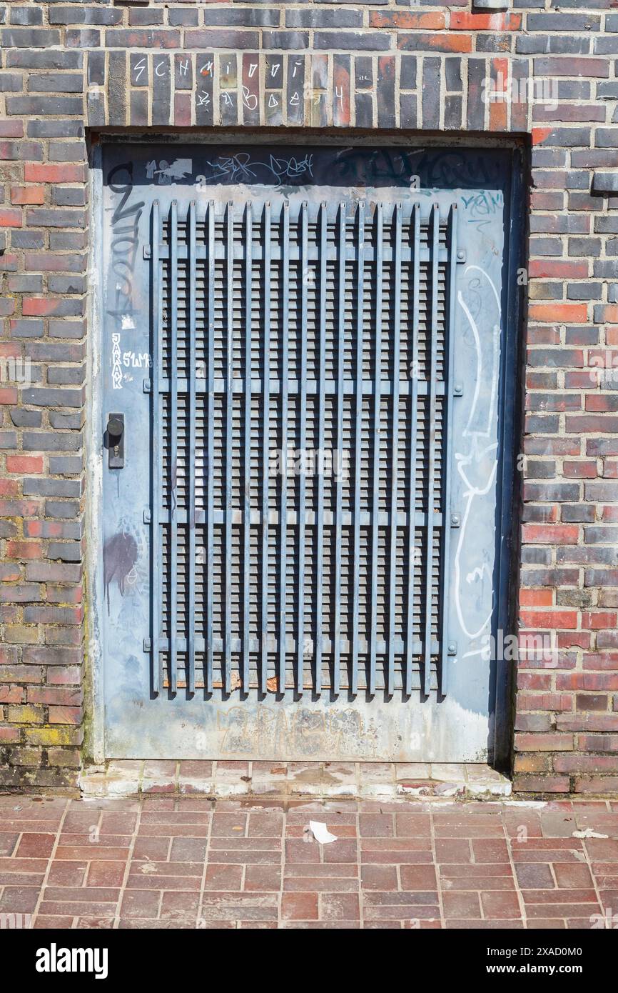 Barred steel door on a brick wall, Germany Stock Photo - Alamy