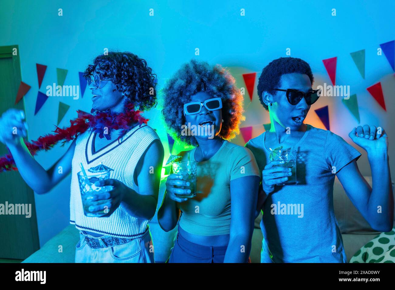 Multi-ethnic friends having fun drinking alcohol and dancing during ...