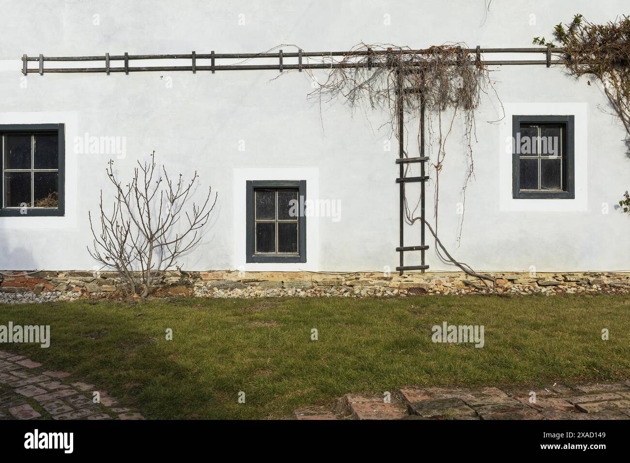 photography of a wall of old white traditional Alpine farmhouse with ...