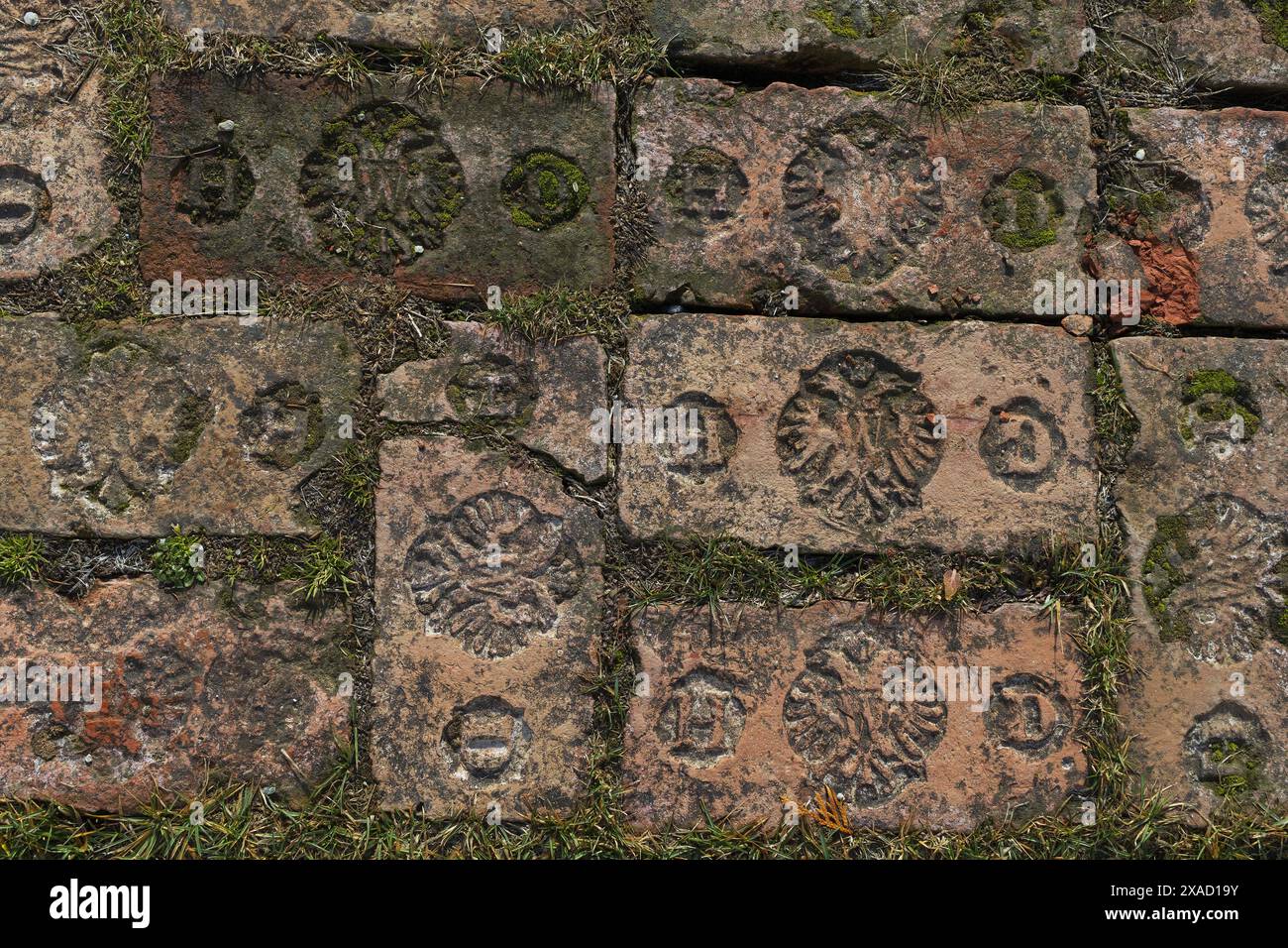 flat photography of an old red brick with marks and initials texture ...