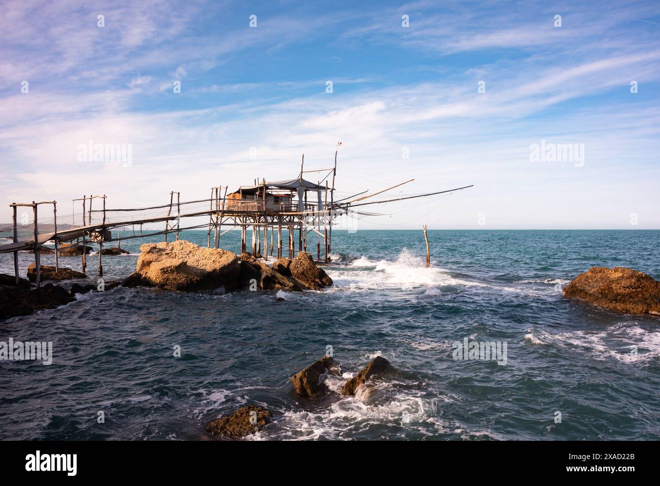 Fishing house with a net on sea bank Stock Photo - Alamy