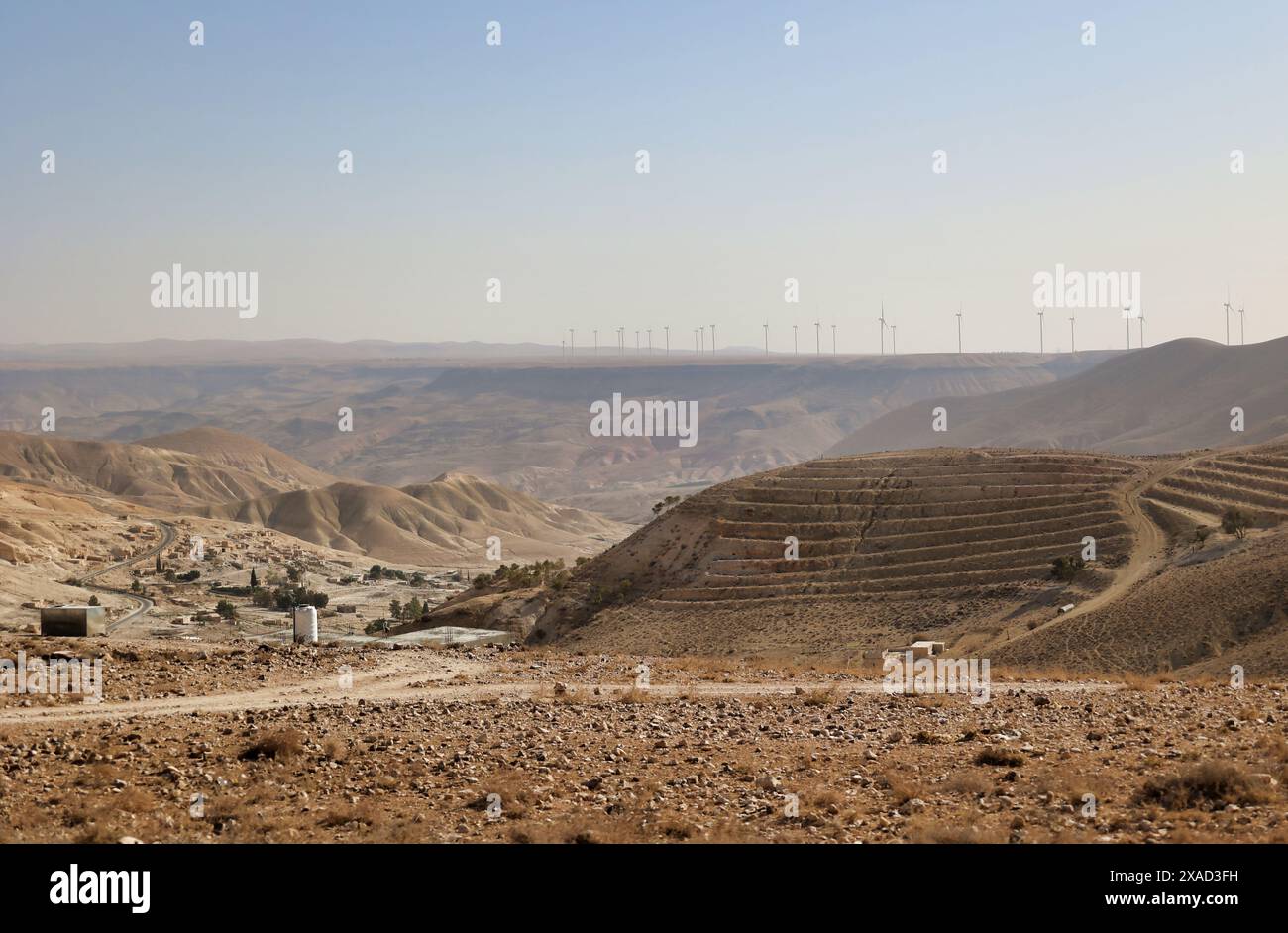 panoramic view of wind turbines for green energy in a desert area ...