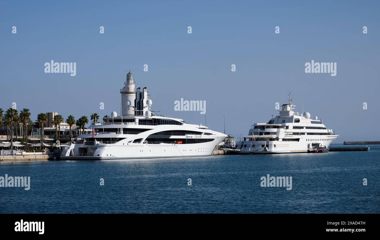 Two big modern luxury superyacht docked at the port of Málaga, southern ...