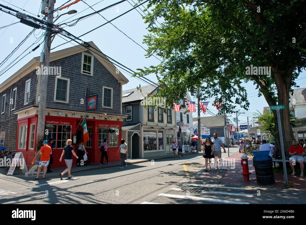 Shops, locals and tourists on Commercial Street. Provincetown, Cape Cod ...