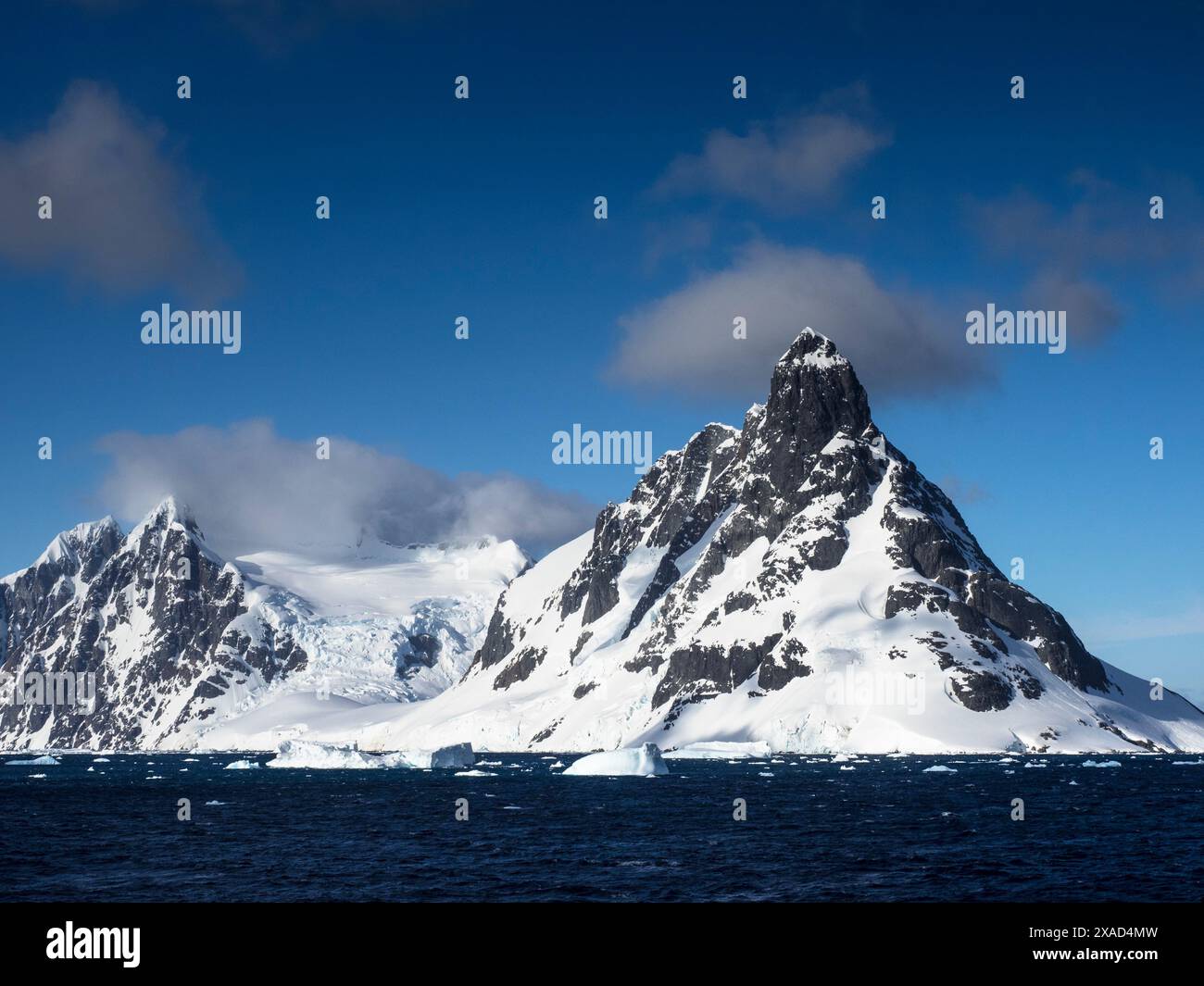 Wandel Peak 9l) and Clery Peak (r) rise above Mt Lacroix and Turquet ...
