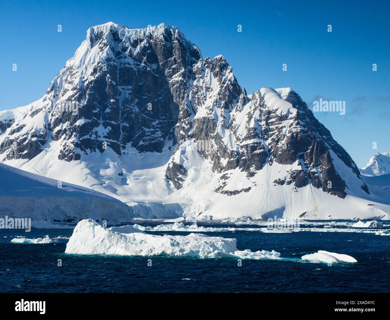 Sea ice (brash ice) and Mt Cloos, Graham Land, at the northern entrance ...