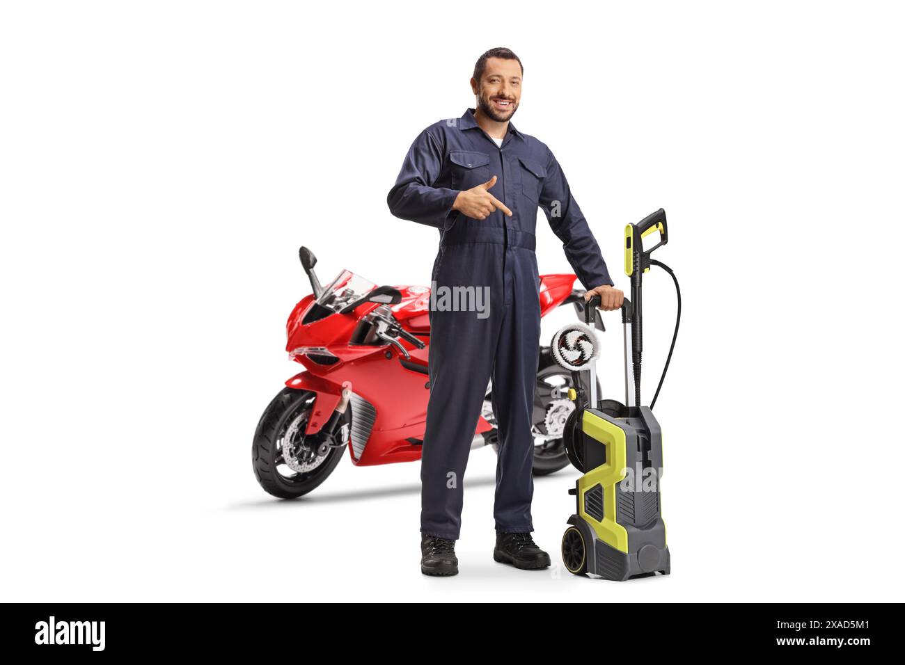 Car was worker pointing at a high pressure washer machine in front of a ...