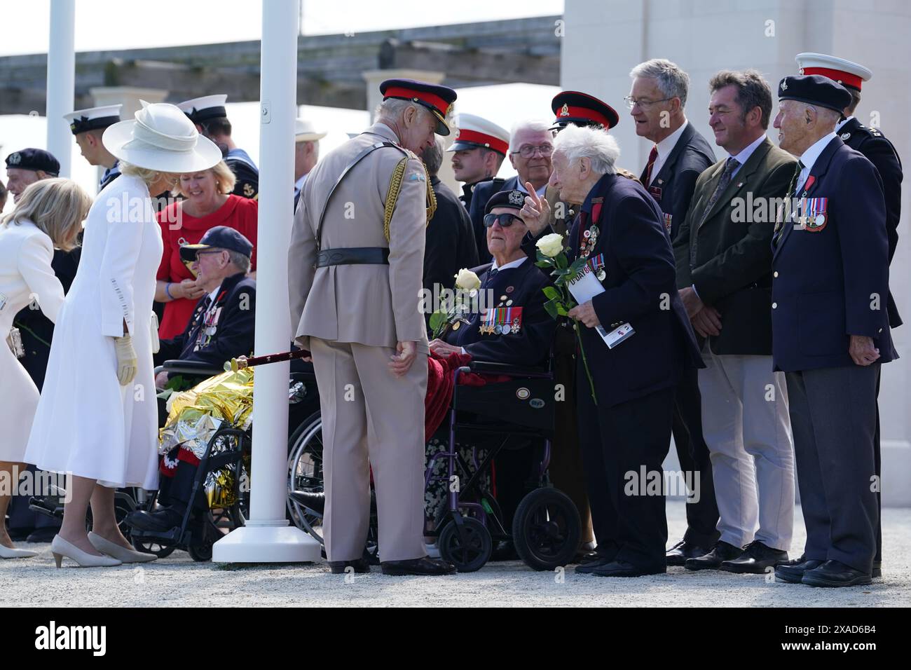 King Charles III and Queen Camilla speak to D-Day veterans, including ...