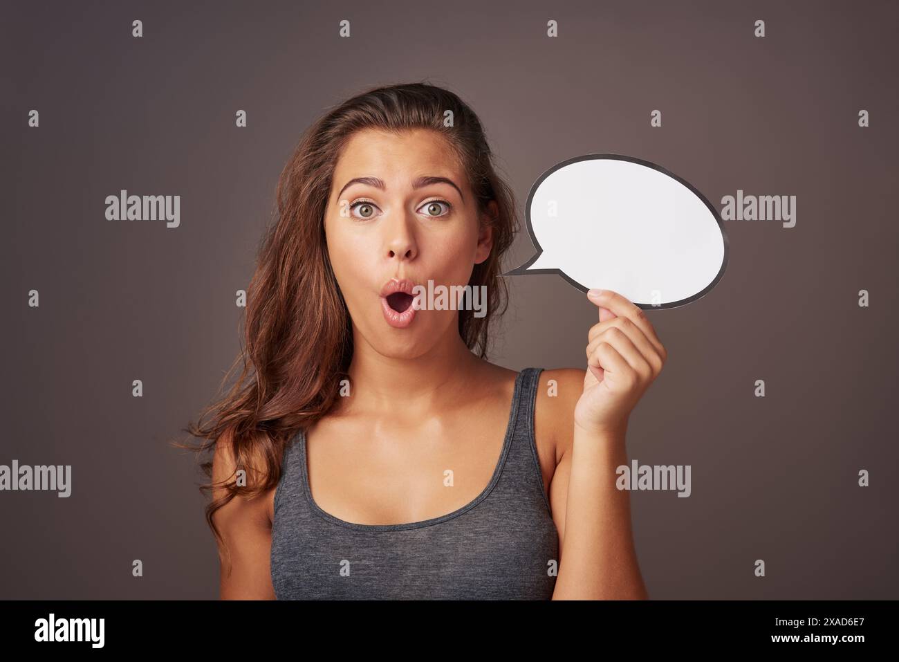 Speech bubble, surprise and portrait of woman in studio for omg news ...