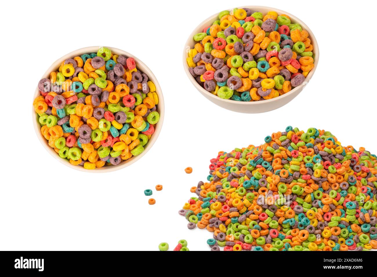 Colorful rings cereal spill out into a bowl. Breakfast. Isolated on a ...