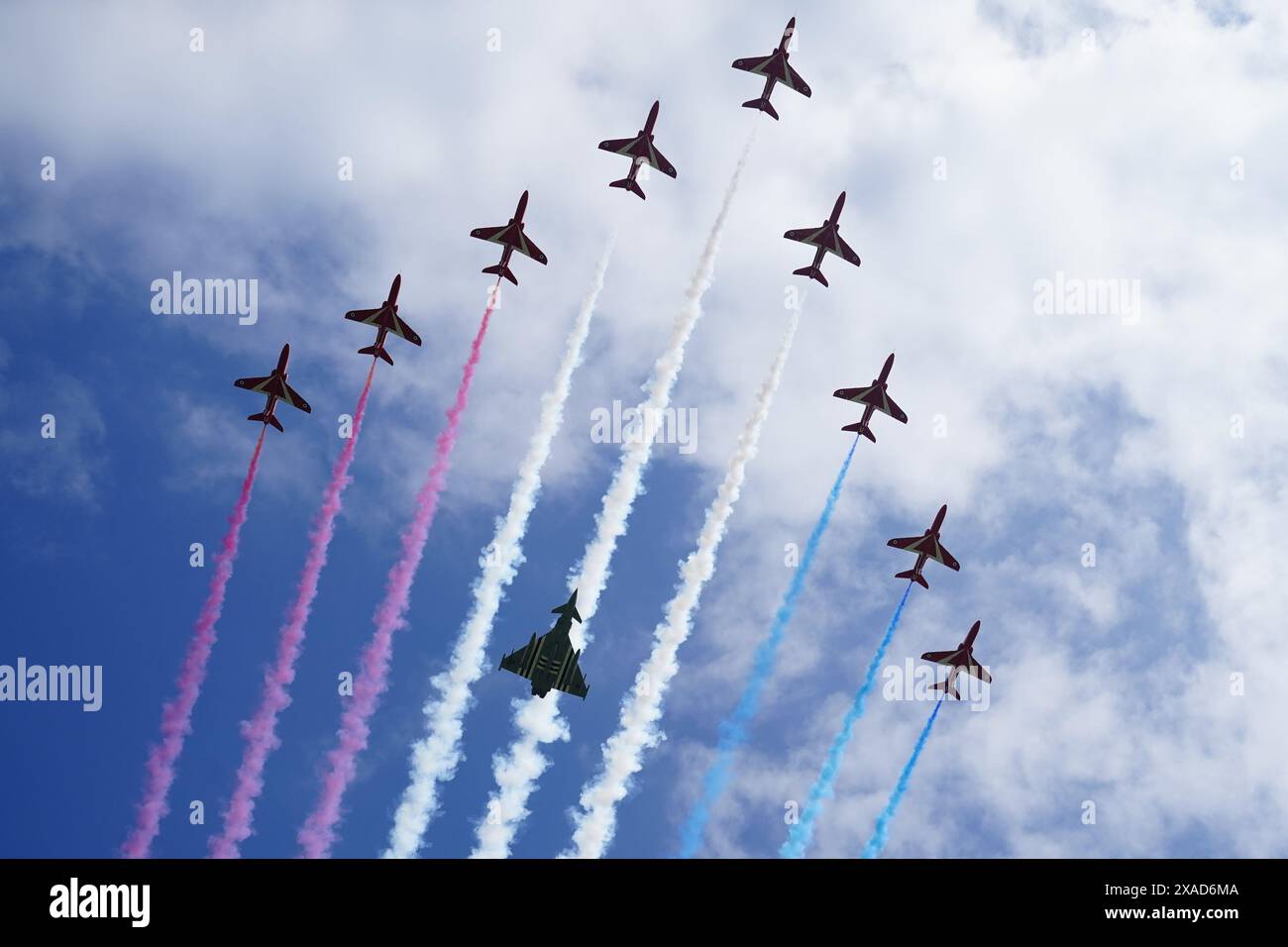 The Red Arrows with a Typhoon FGR4 aircraft perform a flypast during ...