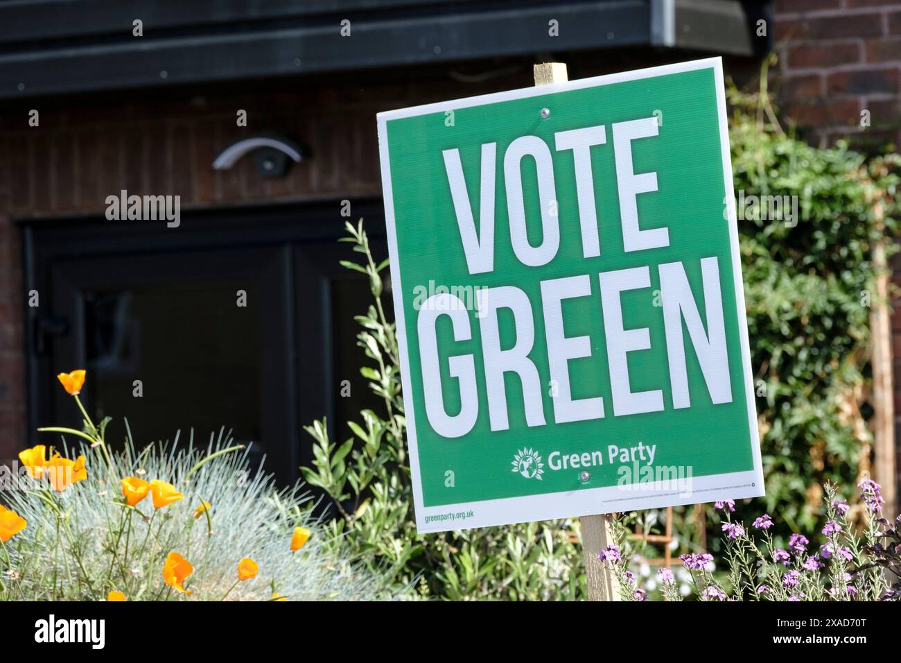 Vote Green posters in a garden setting seen on Bristol Harbourside ...