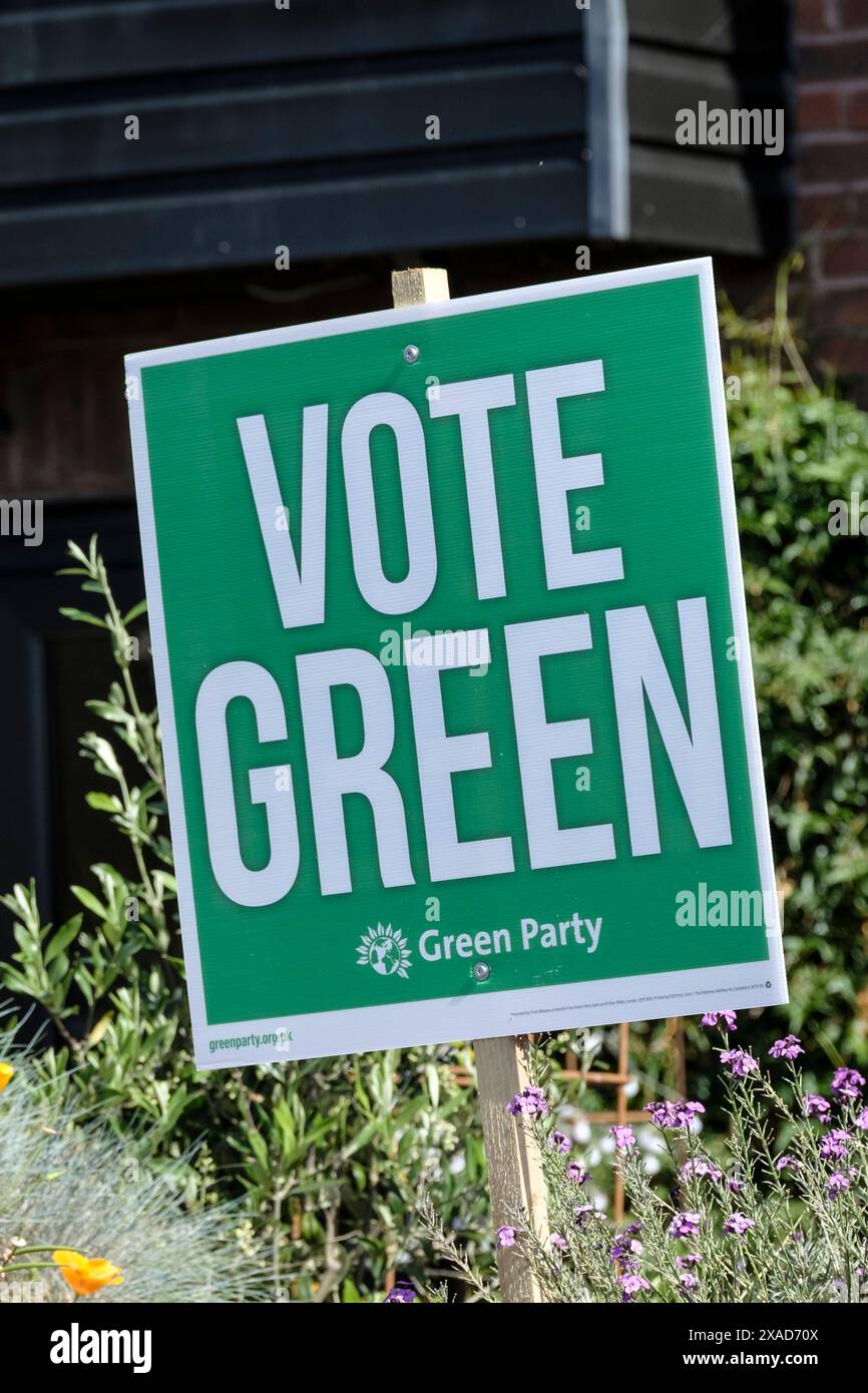 Vote Green posters in a garden setting seen on Bristol Harbourside ...