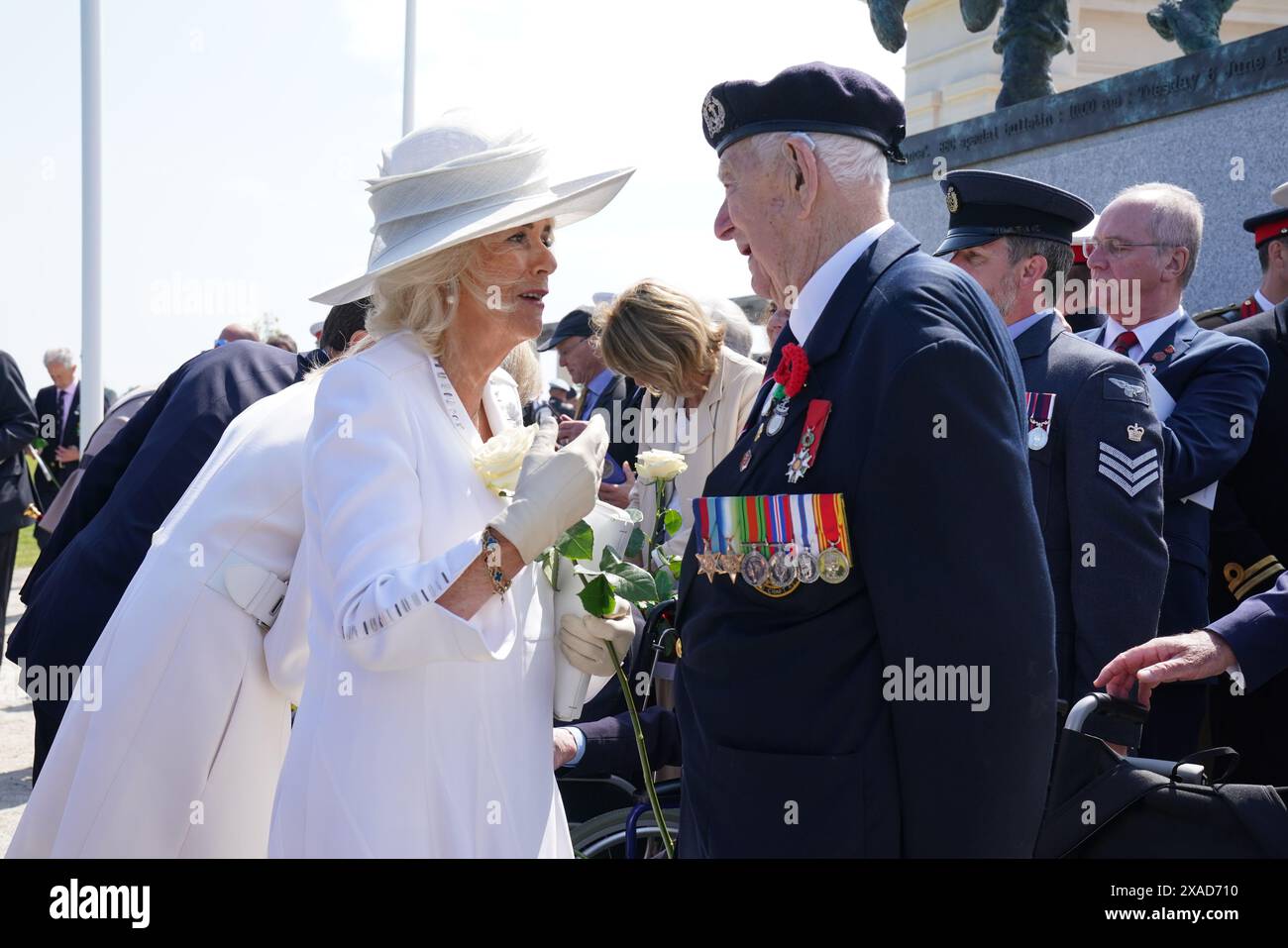 Queen Camilla speaks to D-Day veteran Henry Rice, 98, from Surrey ...