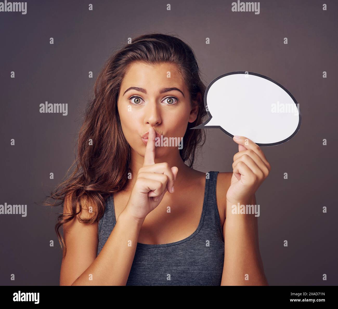 Speech bubble, secret and portrait of woman in studio for whisper ...